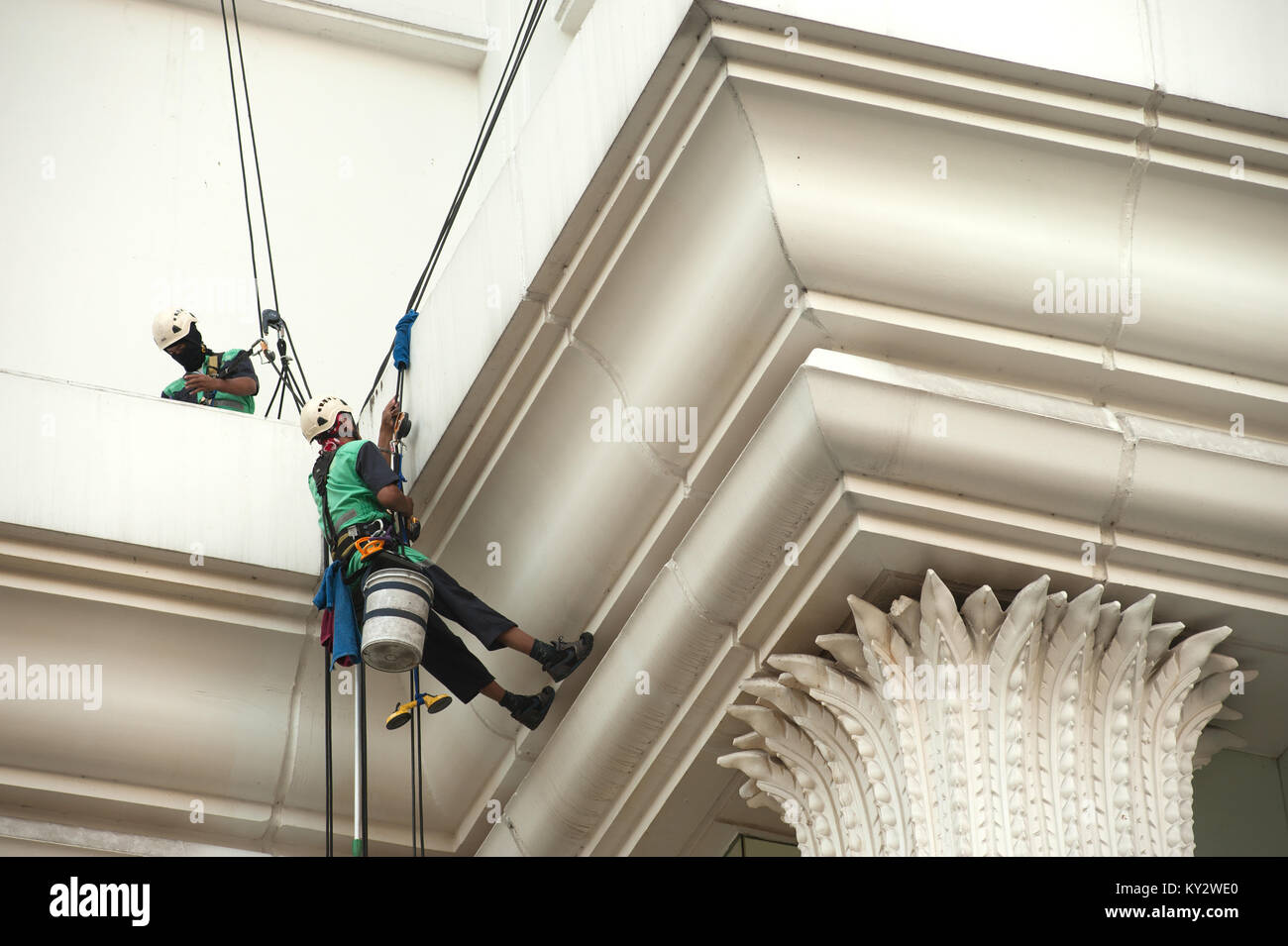 BANGKOK, THAILAND-NOVEMBER 18,2016 :Group of unidentified Glass cleaner ...