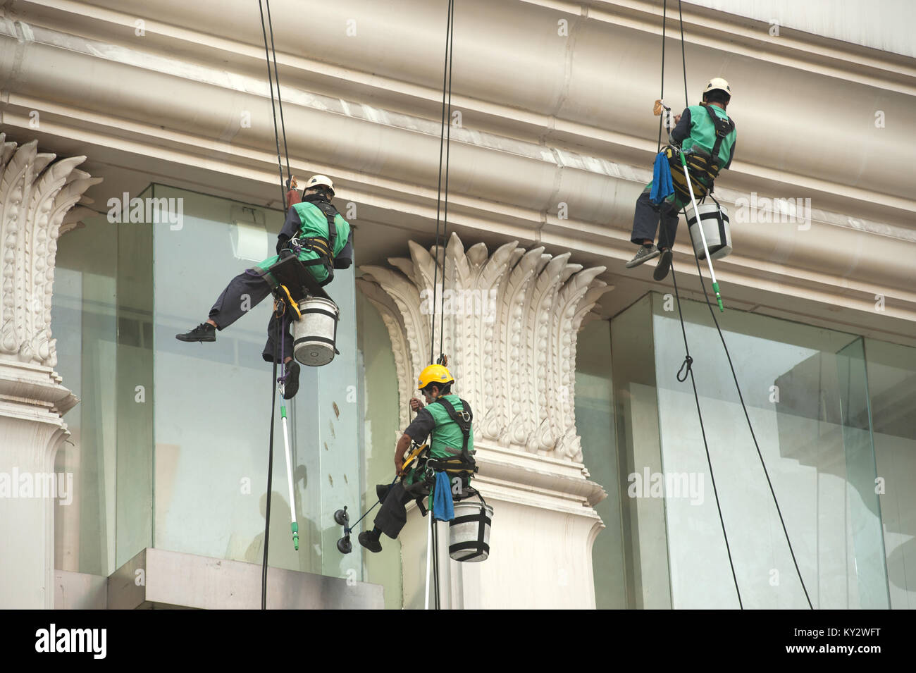 BANGKOK, THAILAND-NOVEMBER 18,2016 :Group of unidentified Glass cleaner ...