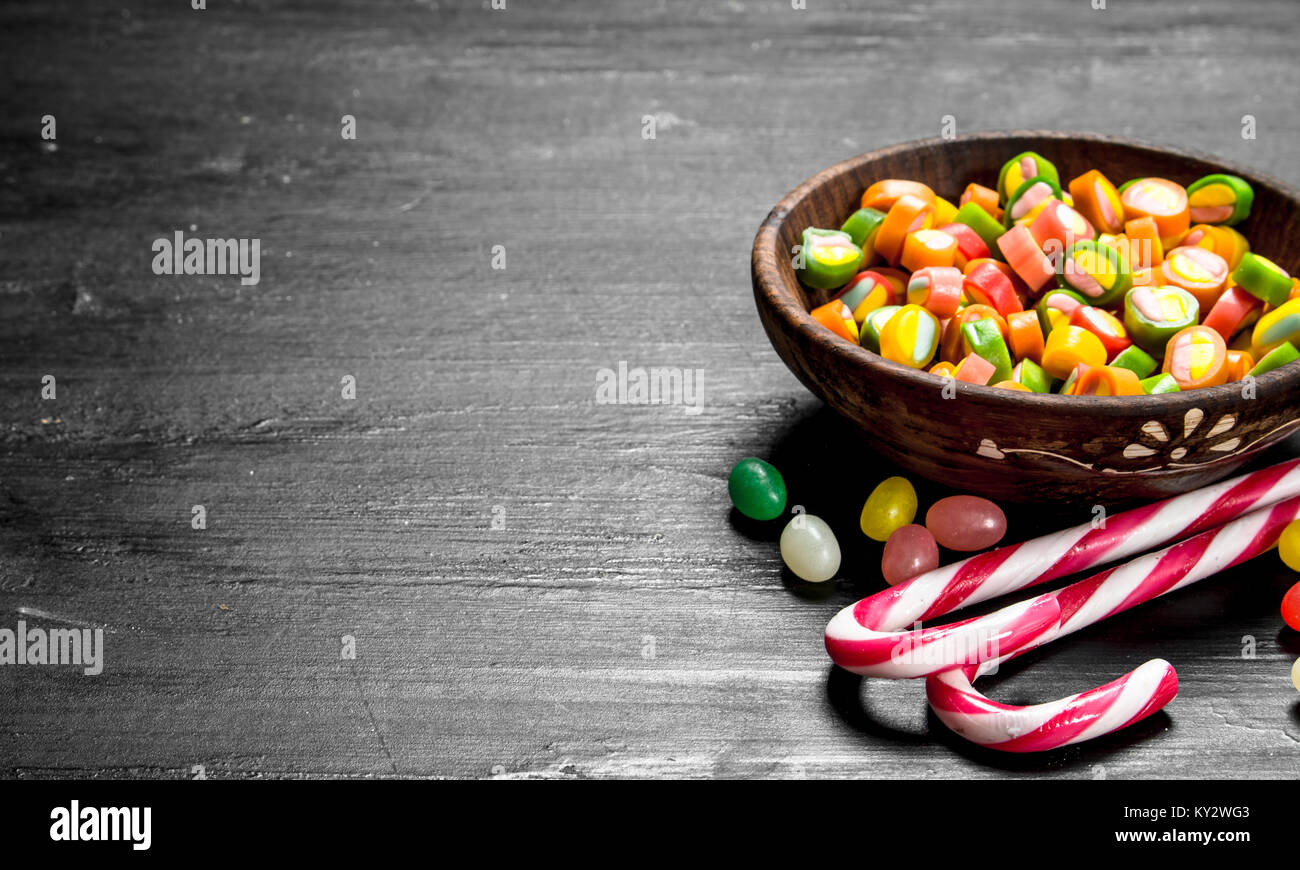 Different baby sweets in bowls. On the black chalkboard Stock Photo - Alamy