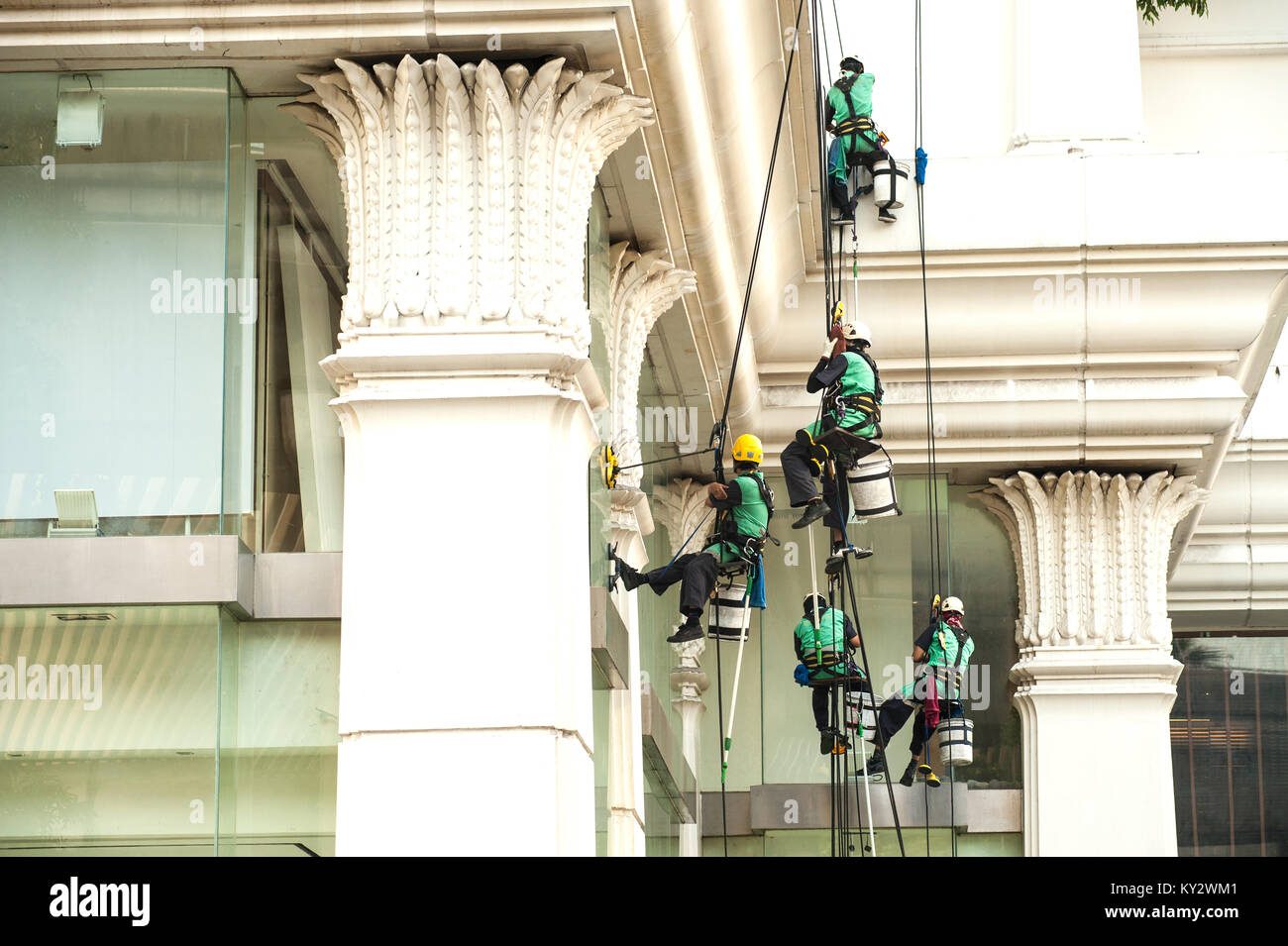 BANGKOK, THAILAND-NOVEMBER 18,2016 :Group of unidentified Glass cleaner ...