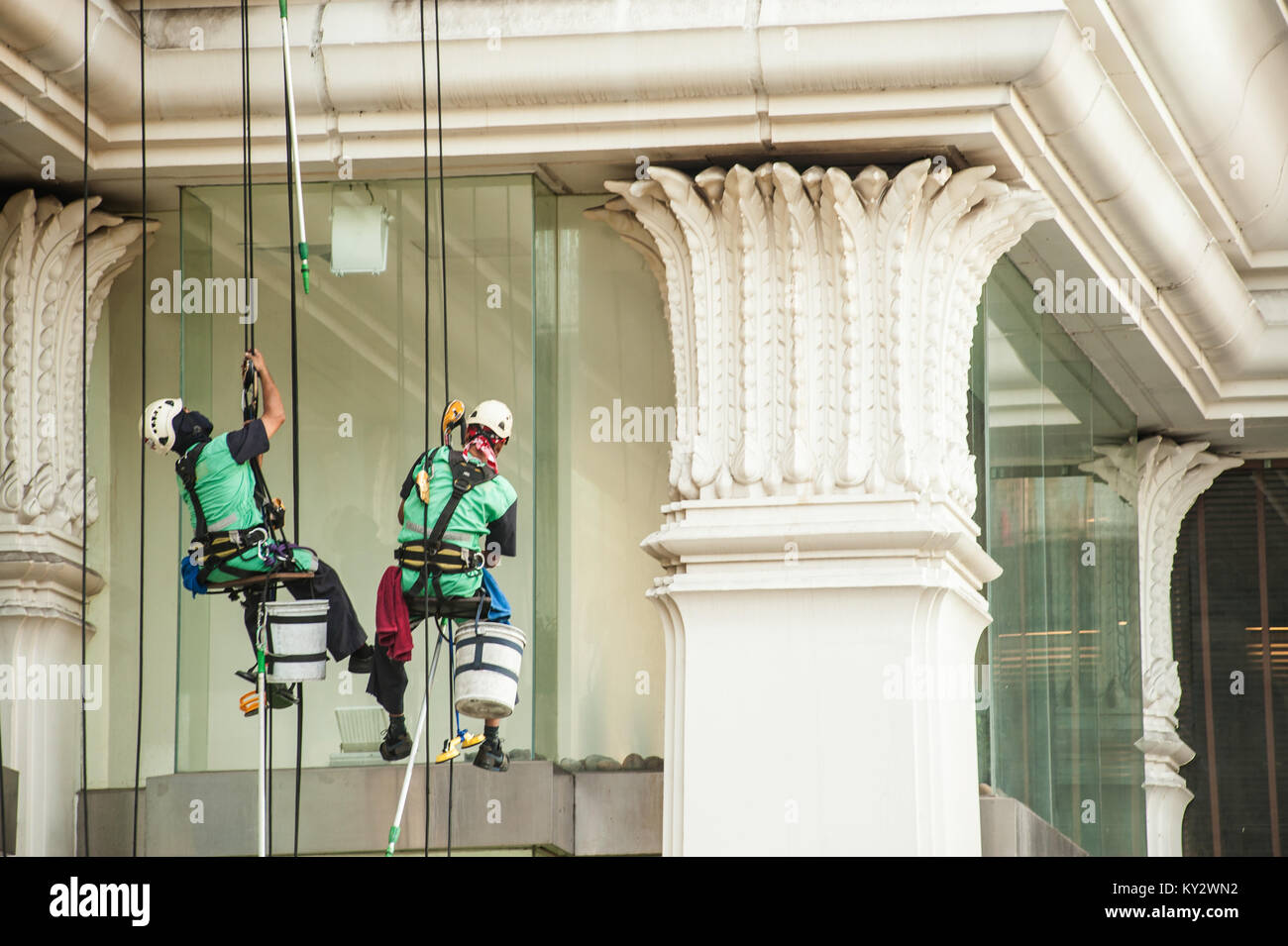 BANGKOK, THAILAND-NOVEMBER 18,2016 :Group of unidentified Glass cleaner ...