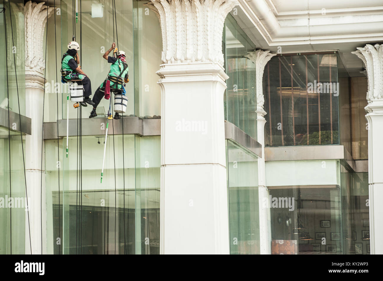 BANGKOK, THAILAND-NOVEMBER 18,2016 :Group of unidentified Glass cleaner ...
