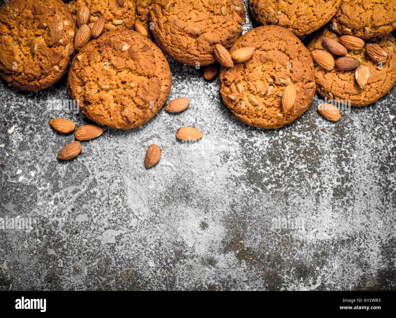 Oatmeal cookies with almonds. On a rustic background Stock Photo - Alamy