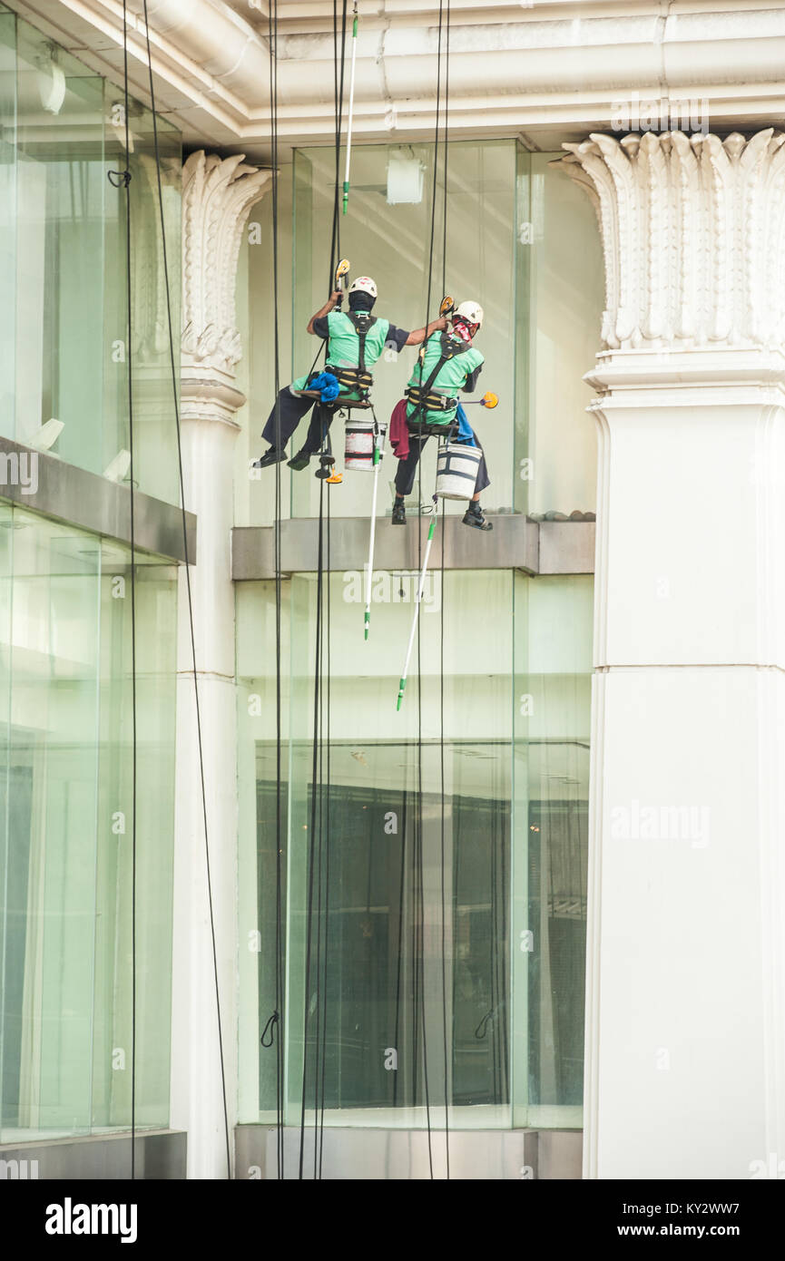 BANGKOK, THAILAND-NOVEMBER 18,2016 :Group of unidentified Glass cleaner ...
