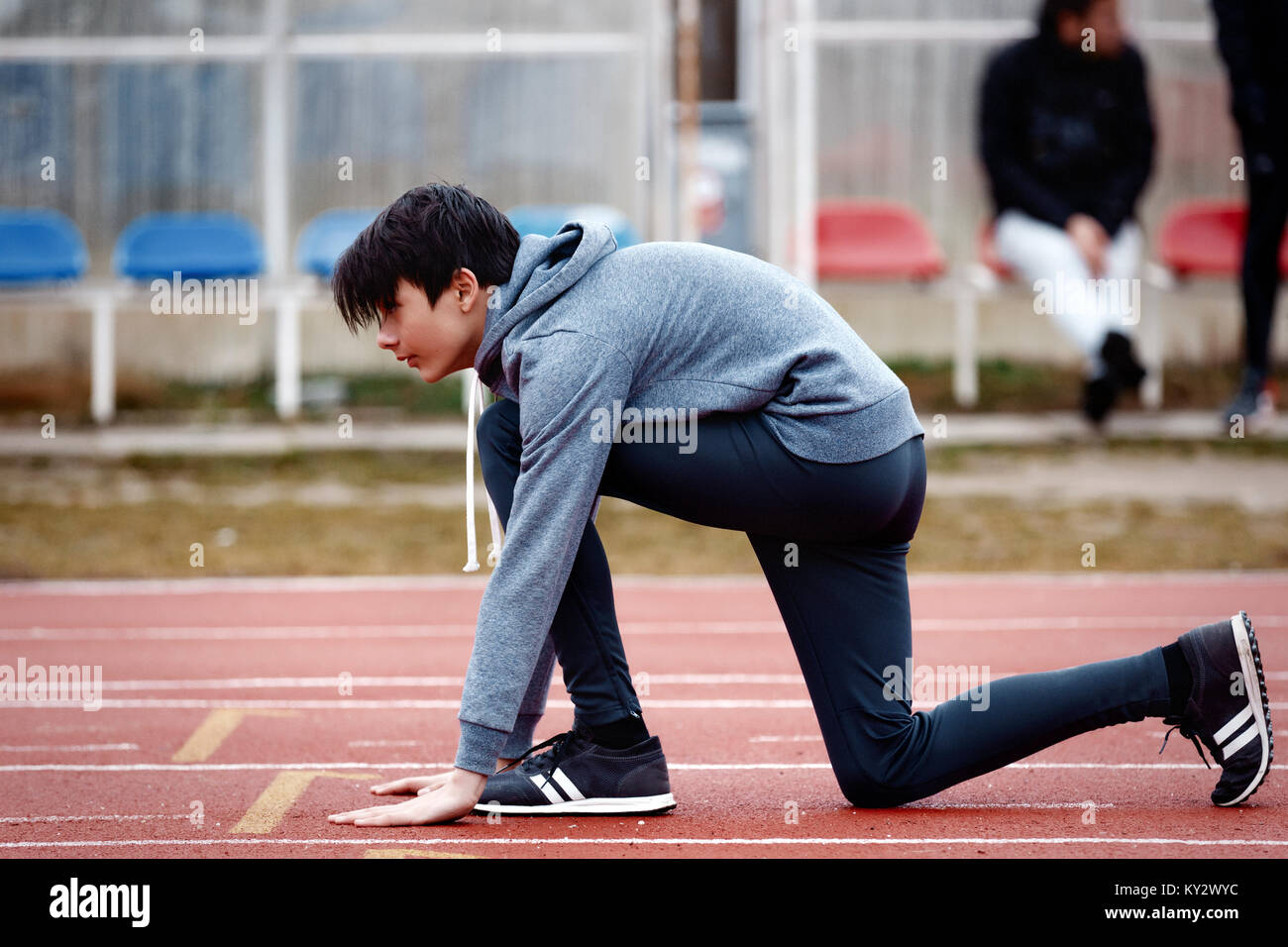 young male athlete in starting position Stock Photo - Alamy