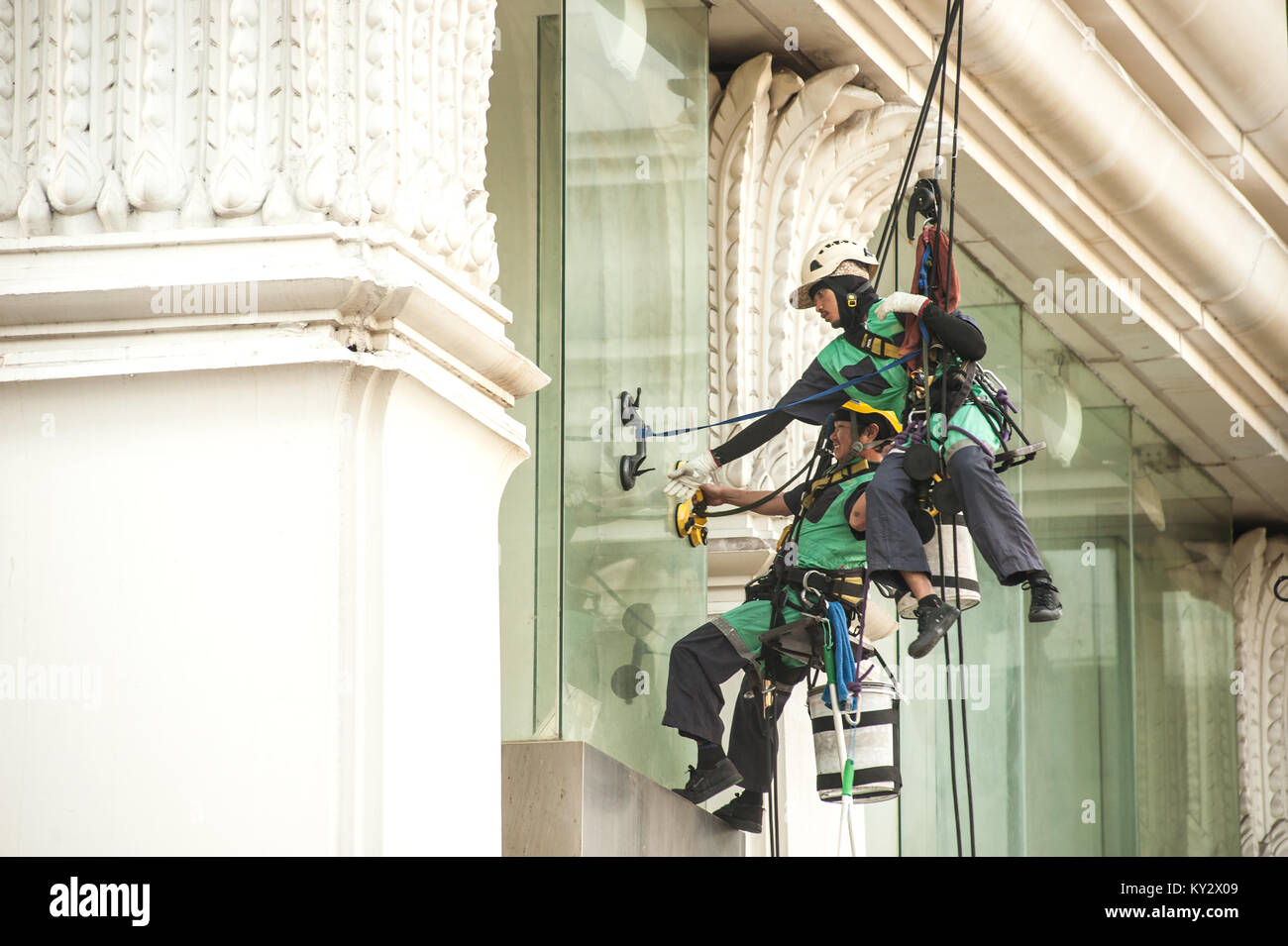 BANGKOK, THAILAND-NOVEMBER 18,2016 :Group of unidentified Glass cleaner ...