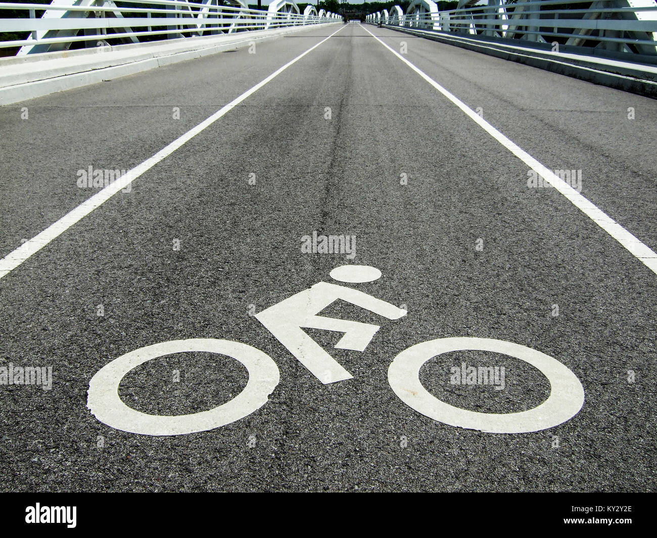 Bicycle lane with an abstract graphic sign of a bicycle with rider ...