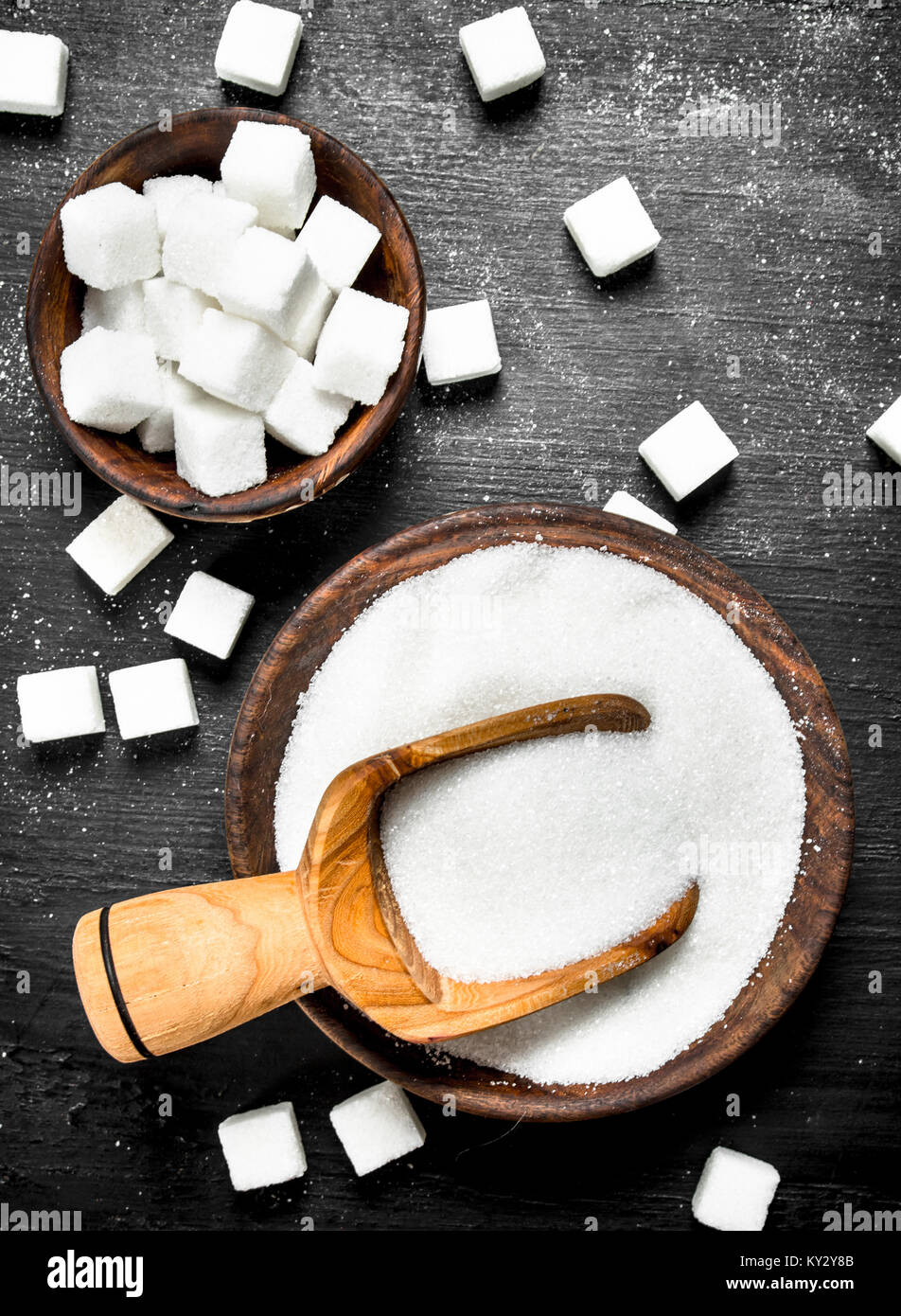 Sugar in a bowl with a scoop. On the black chalkboard Stock Photo - Alamy