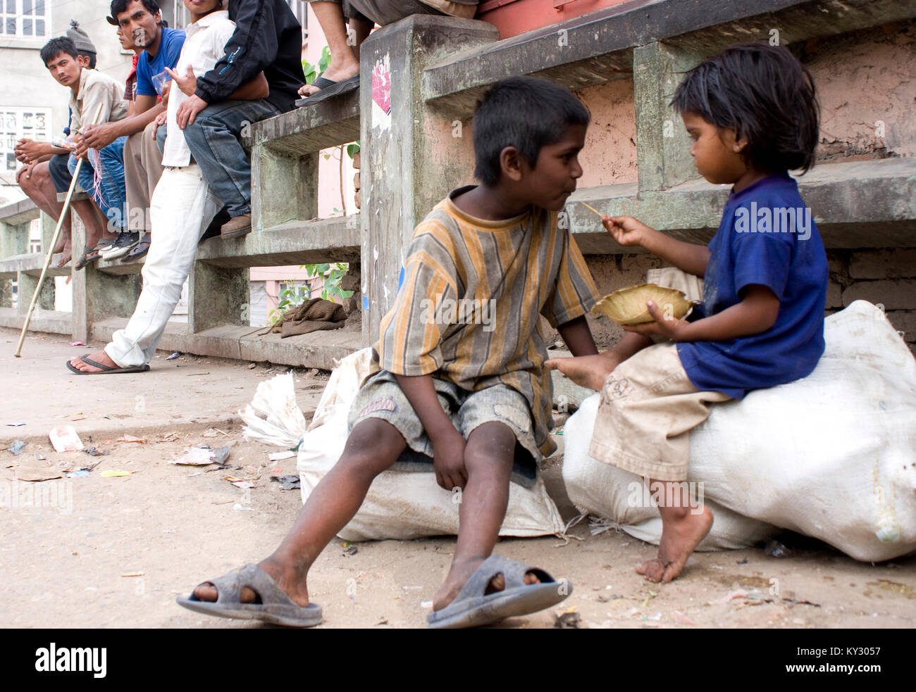 Sharing is caring. Children share food in Putalishadak Kathmandu Stock ...