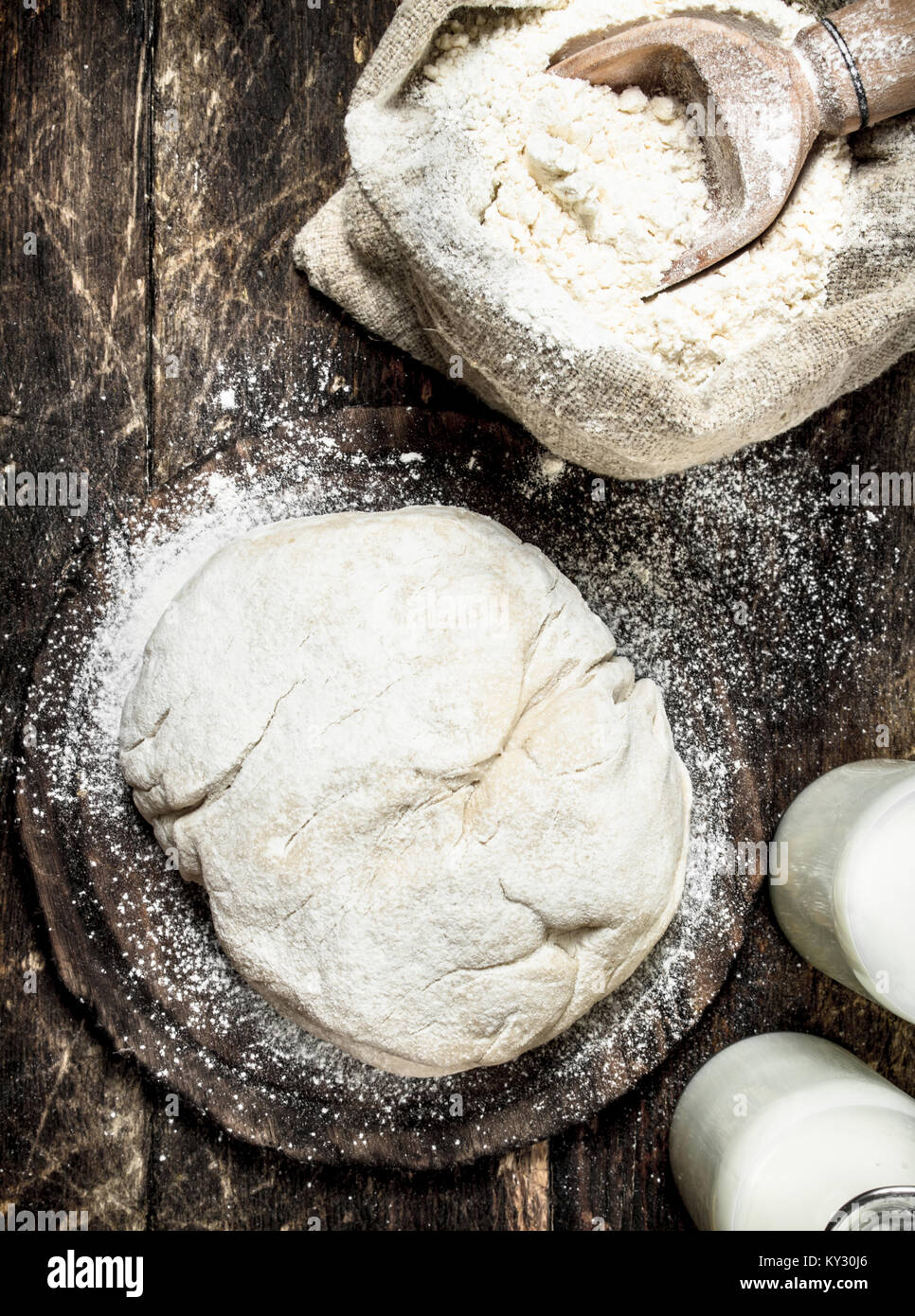 Dough made from fresh milk flour. On a wooden table Stock Photo - Alamy