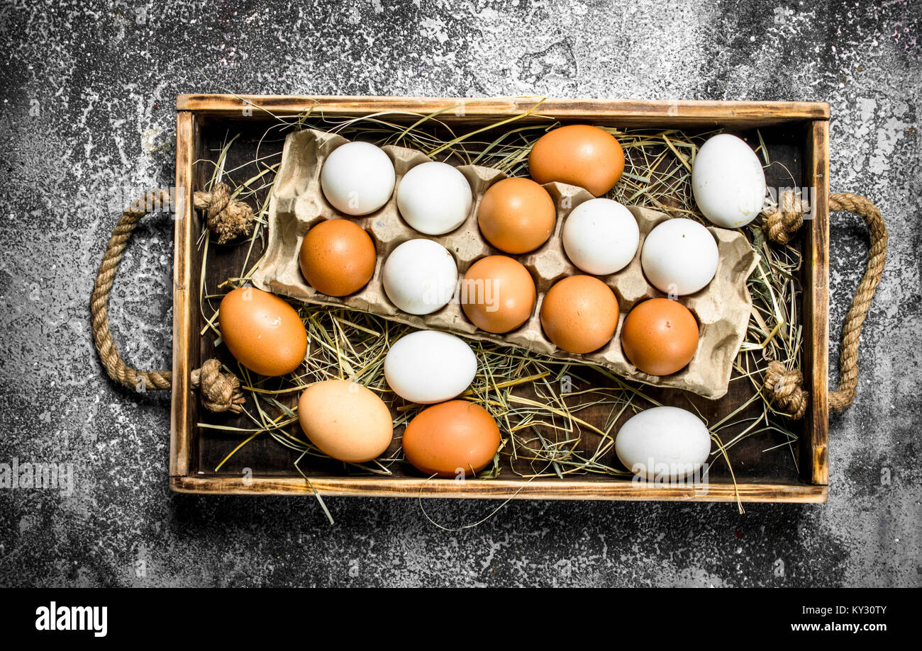 Fresh chicken eggs on an old tray. On a rustic background Stock Photo ...