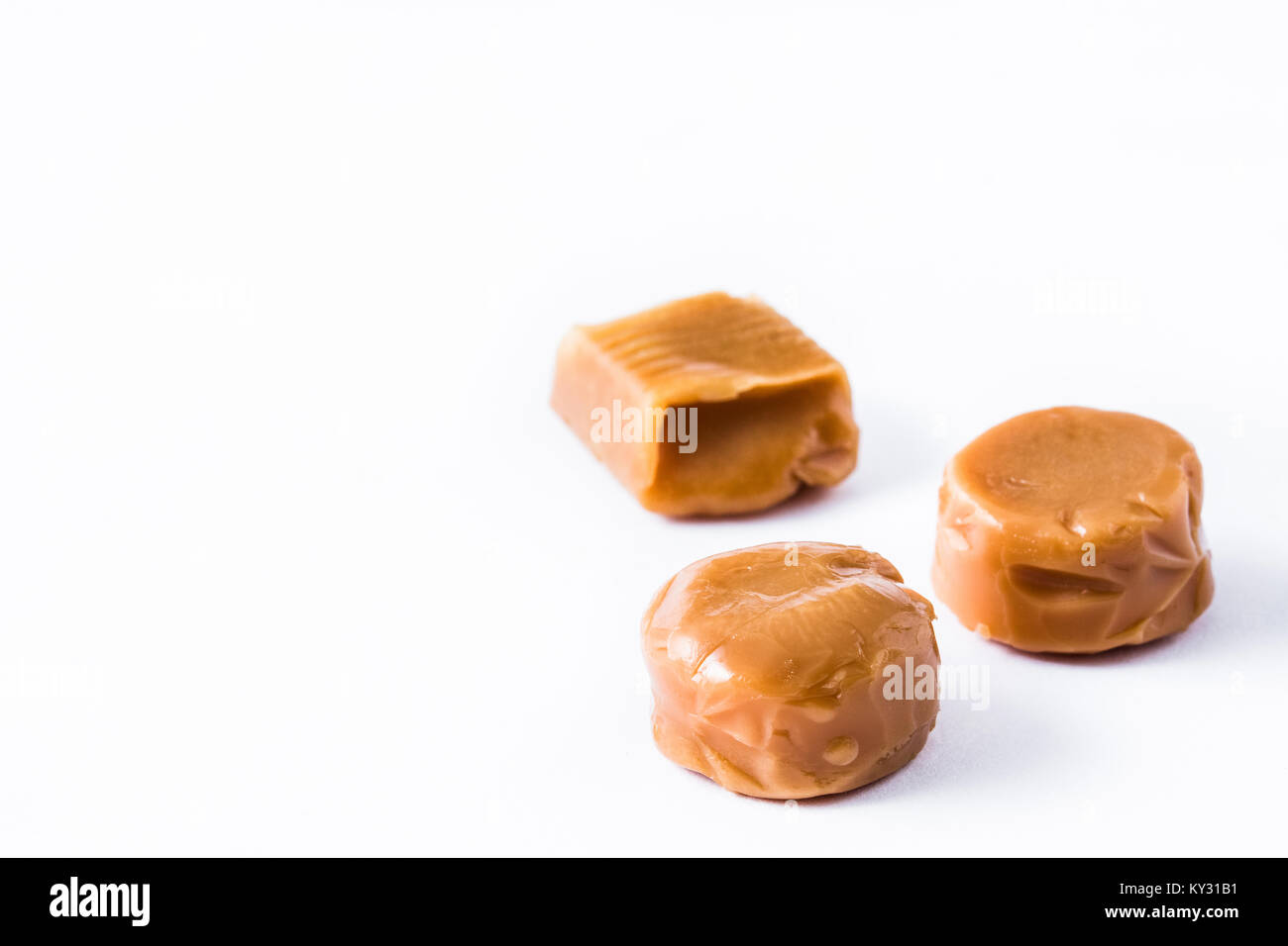 Toffee caramel candies isolated on white background Stock Photo - Alamy