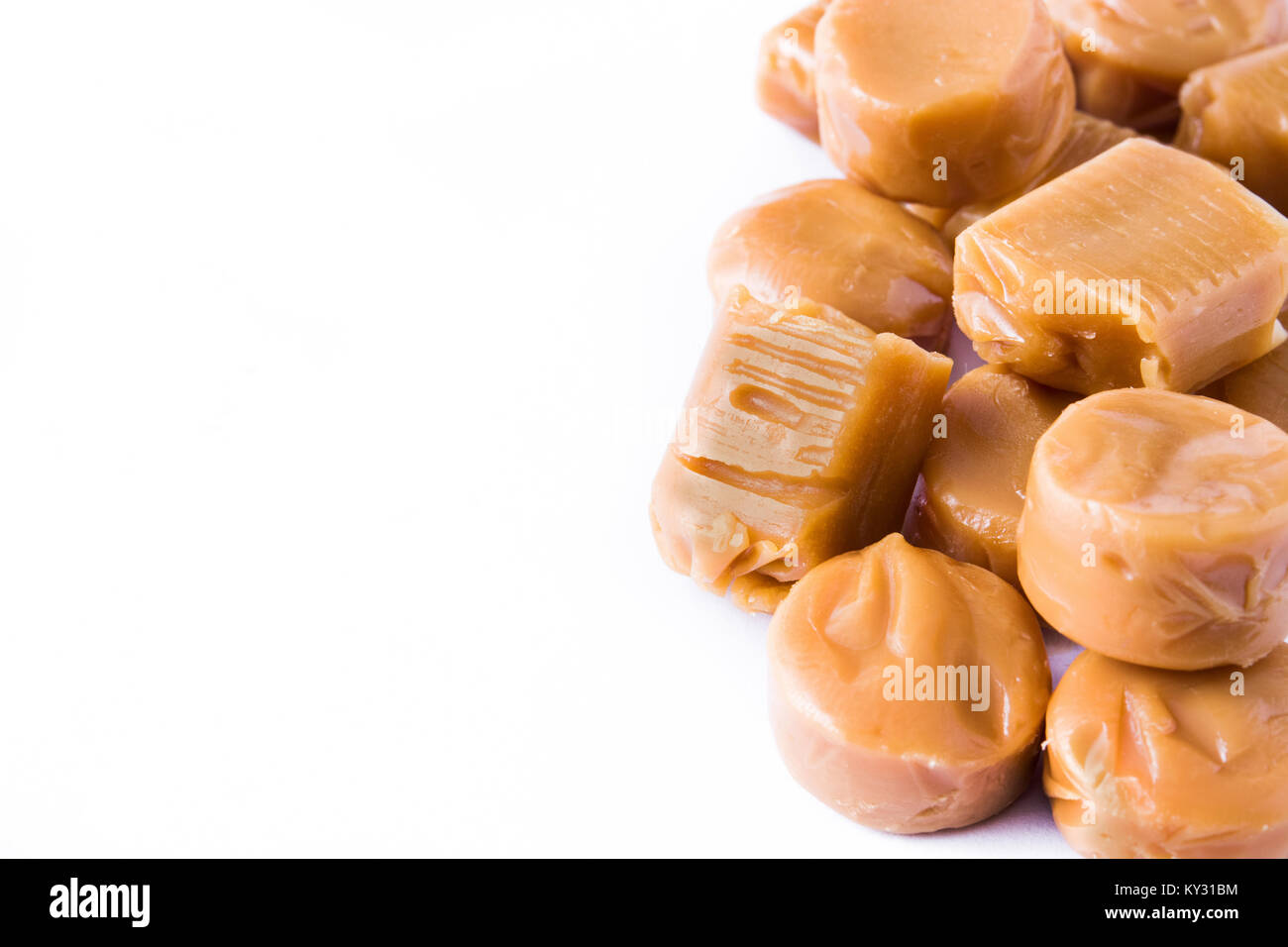 Toffee caramel candies isolated on white background Stock Photo - Alamy