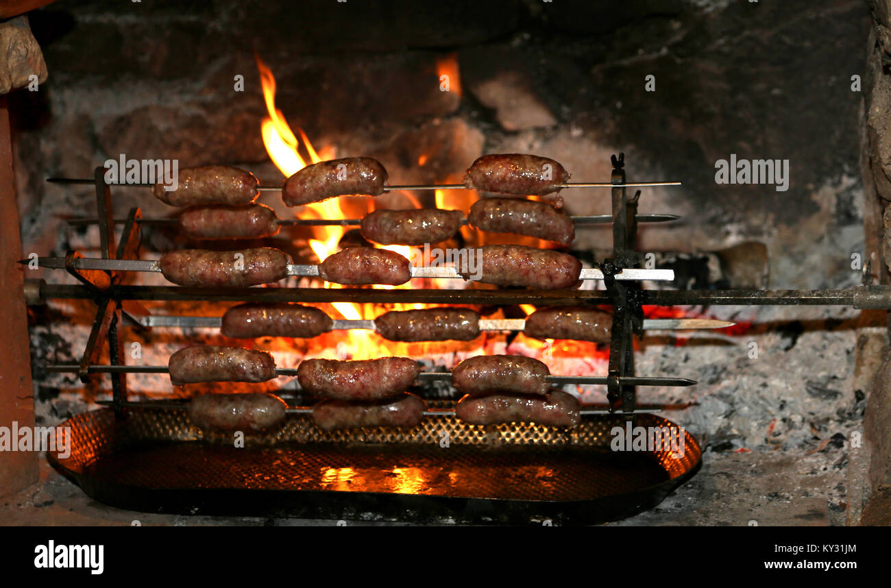 cooking many sausage with hot fire during village festival Stock Photo ...