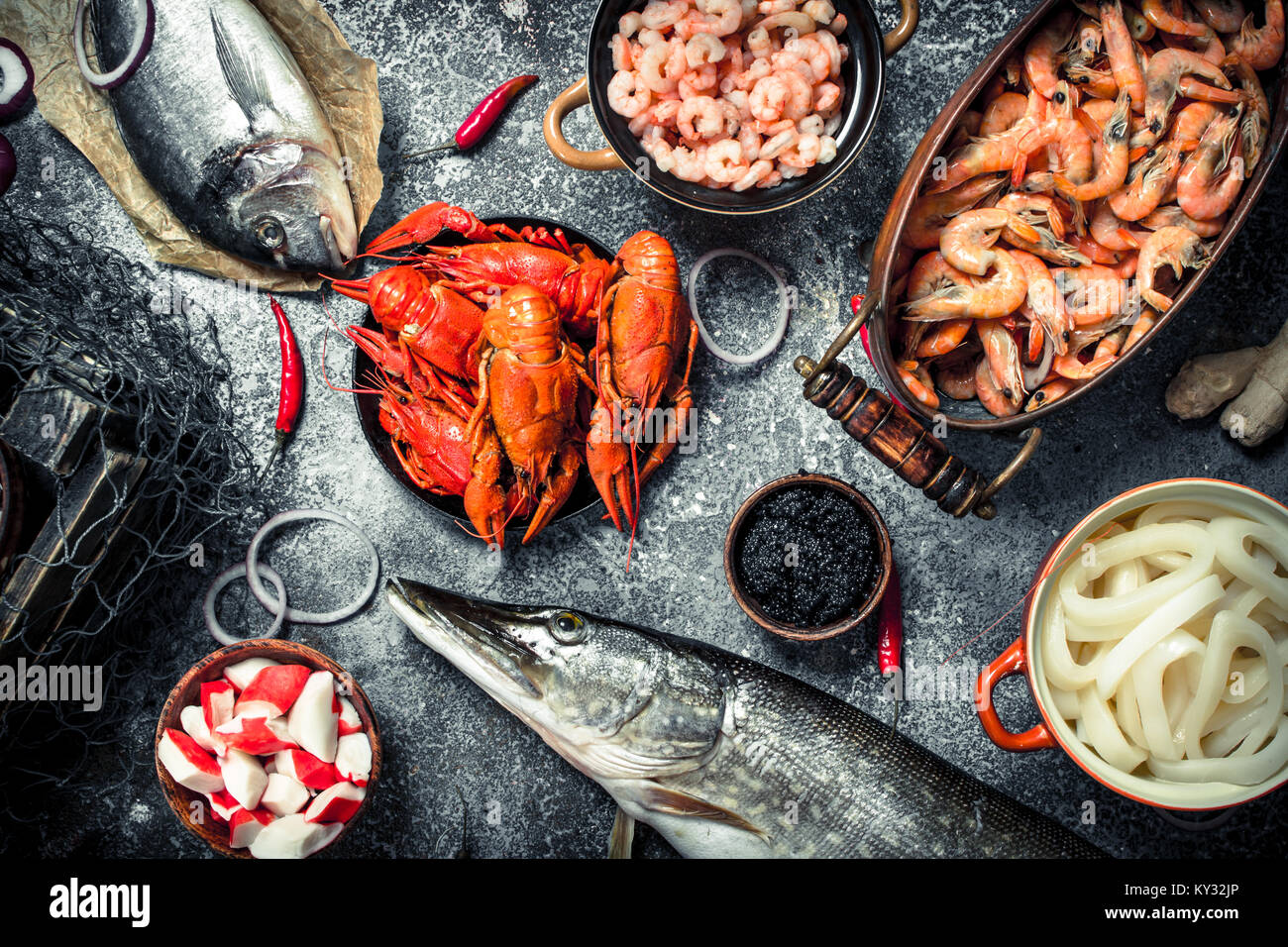 Different fresh seafood. On a rustic background Stock Photo - Alamy