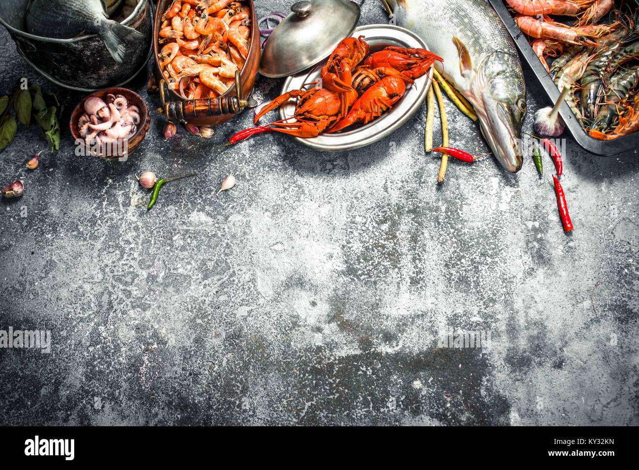 Different fresh seafood. On a rustic background Stock Photo - Alamy