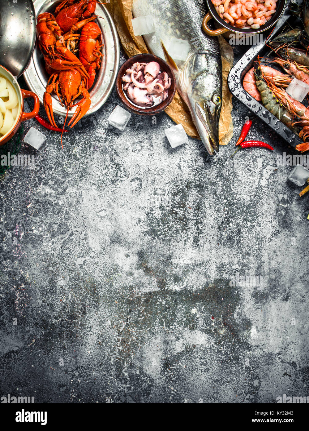 Different fresh seafood. On a rustic background Stock Photo - Alamy