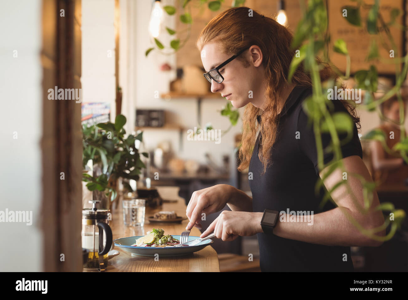 Woman having breakfast table hi-res stock photography and images - Alamy