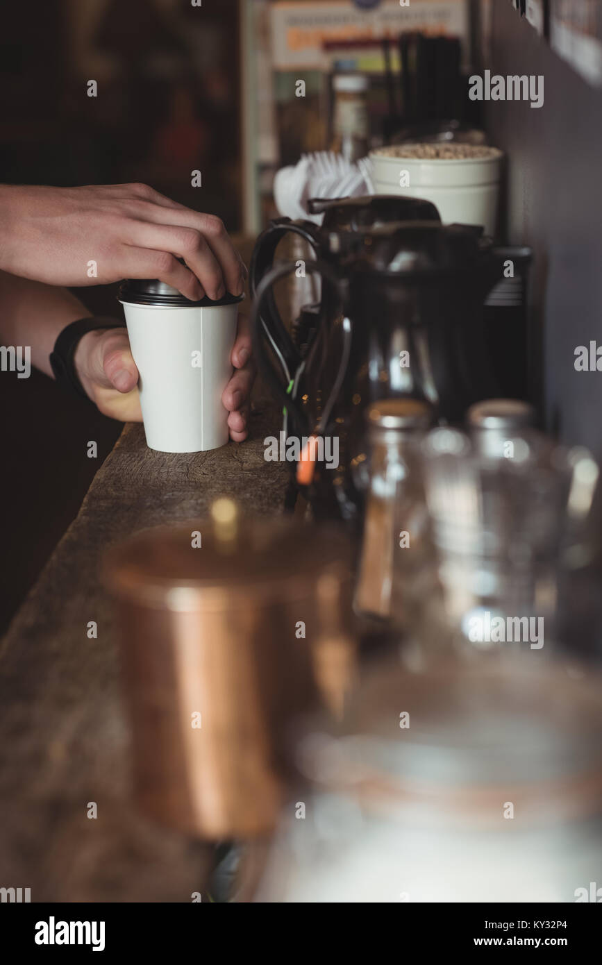 Waiter making coffee at counter Stock Photo - Alamy