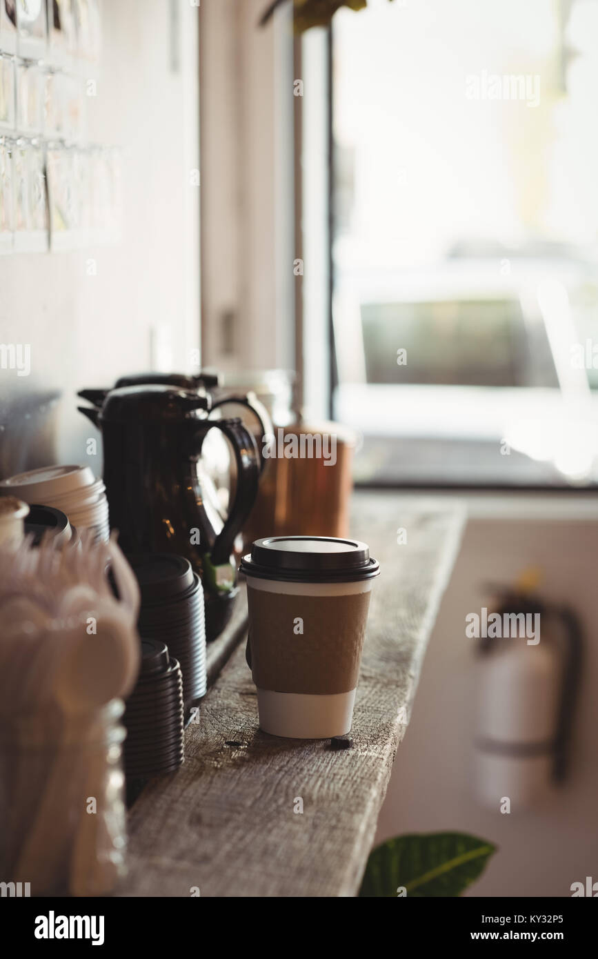 Disposable glass and jug on table Stock Photo - Alamy