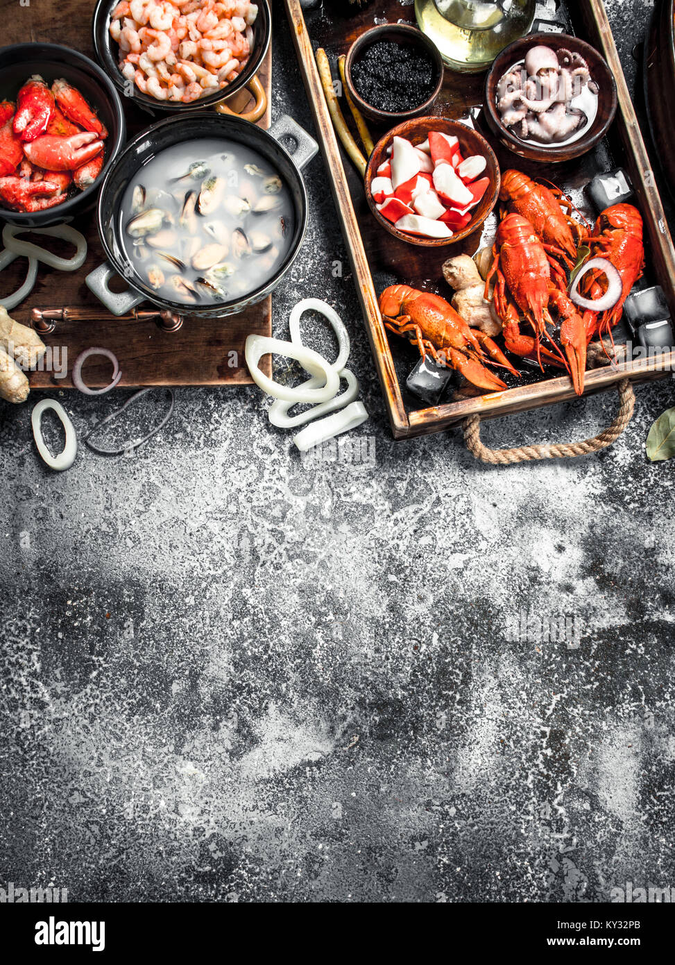 Different fresh seafood. On a rustic background Stock Photo - Alamy