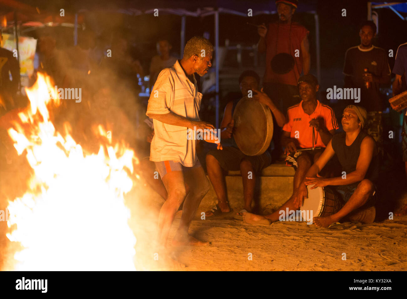 Old man dancing to street musicians at night Stock Photo - Alamy