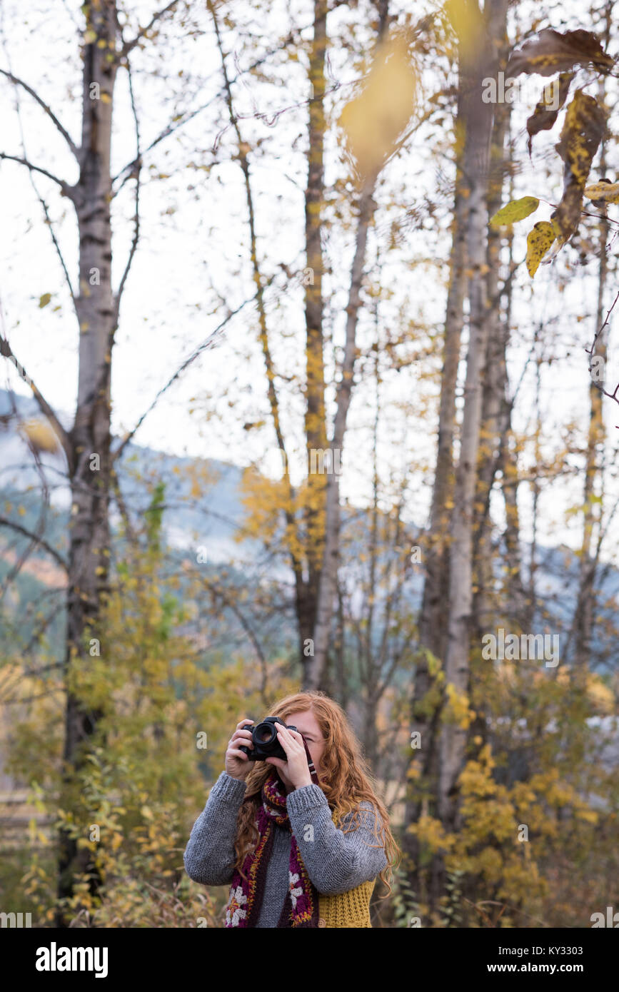 Woman taking picture autumn hi-res stock photography and images - Alamy