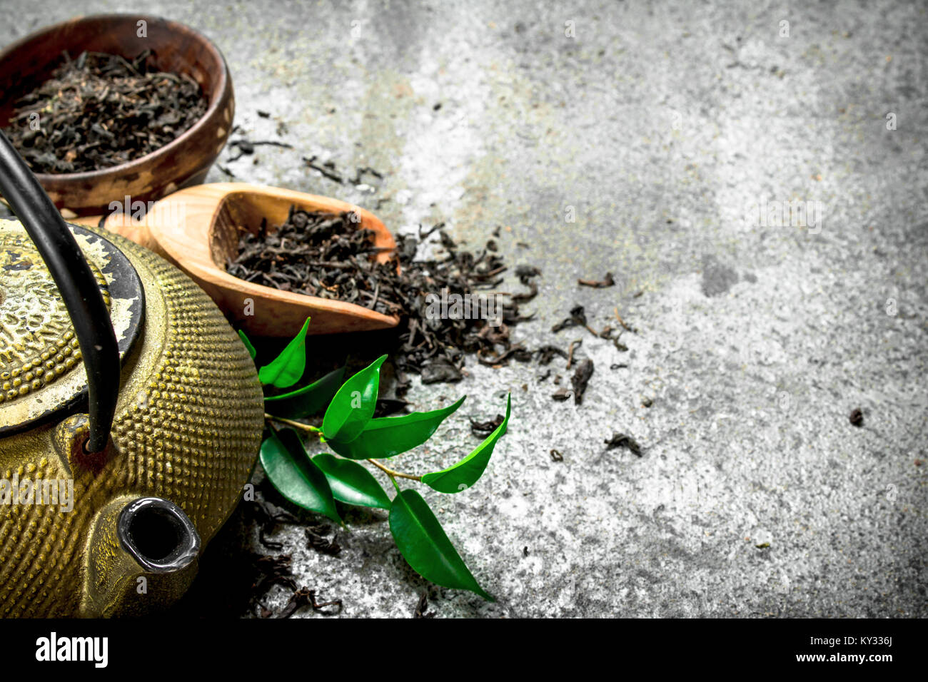 Teapot with fragrant tea. On a rustic background Stock Photo - Alamy