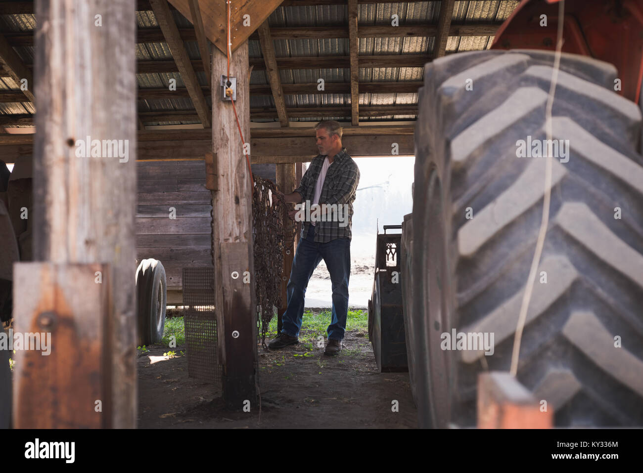 Framer tractor with chain Stock Photo - Alamy