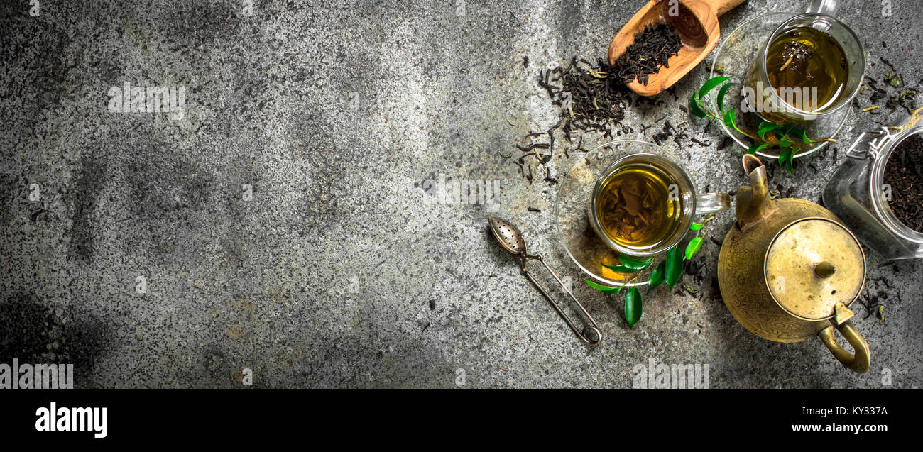 Fresh Indian tea with a brewer. On a rustic background Stock Photo - Alamy