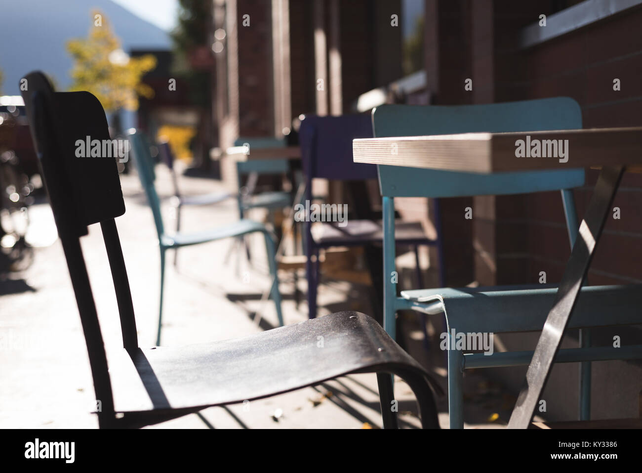 Empty chair at outdoor cafe Stock Photo - Alamy