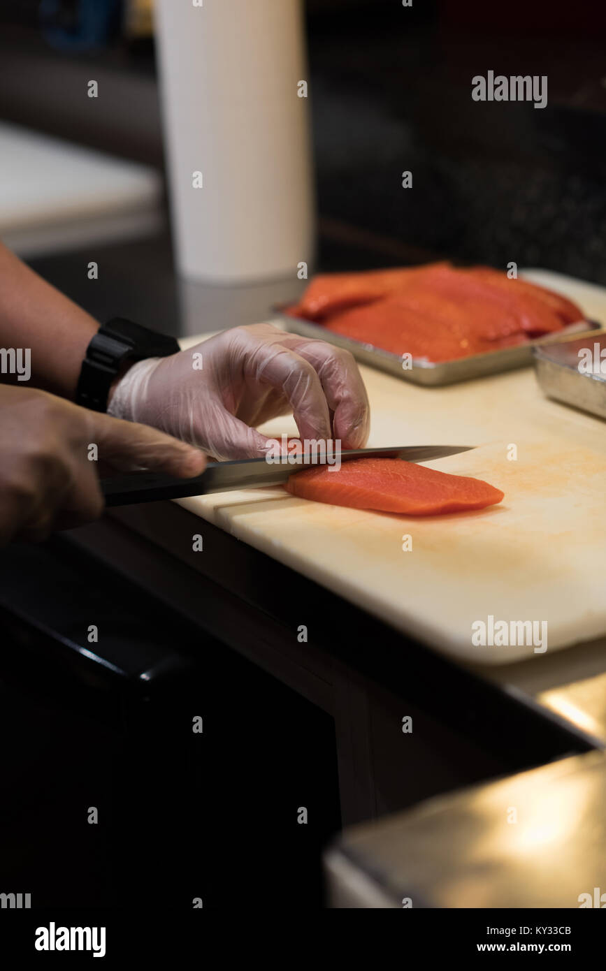 Chef filleting fish in the restaurant kitchen Stock Photo - Alamy