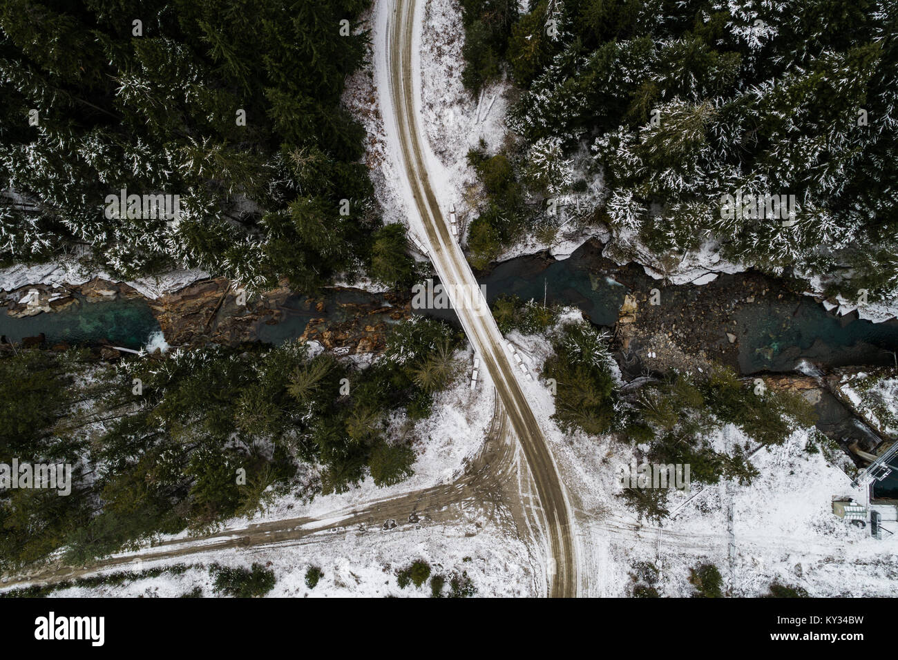 Bridge passing over the river and coniferous forest Stock Photo - Alamy