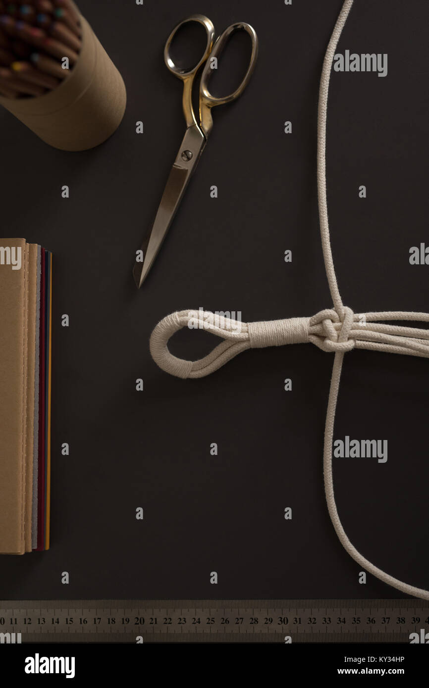Tied strings on table Stock Photo - Alamy