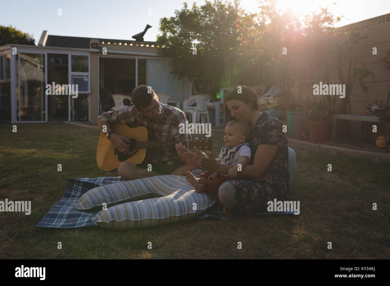 Family having fun in garden Stock Photo - Alamy