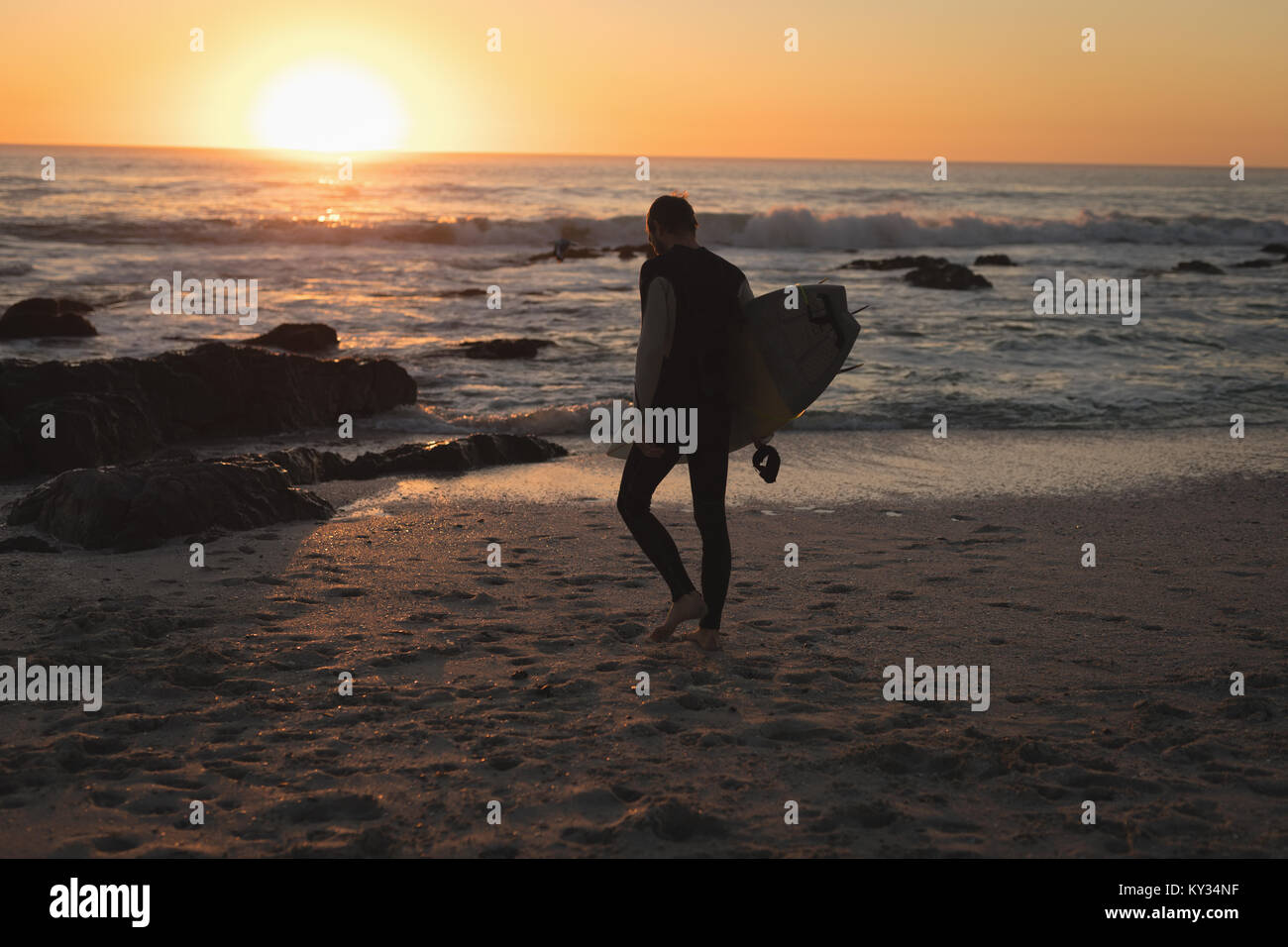 Surfer walking with surfboard hi-res stock photography and images - Alamy