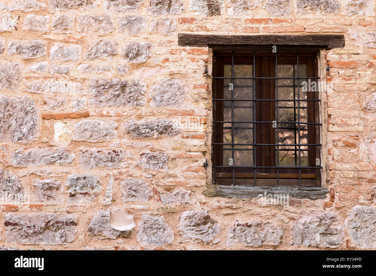 Assisi (Italy): Window on medieval stone wall Stock Photo - Alamy