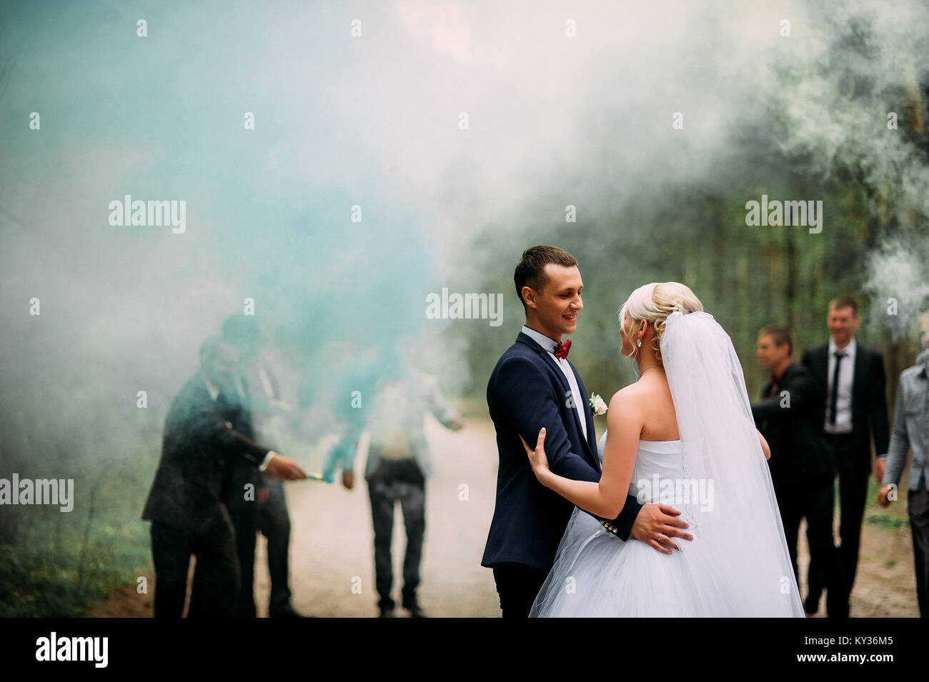 Wedding couple with color smoke in the summer park Stock Photo - Alamy