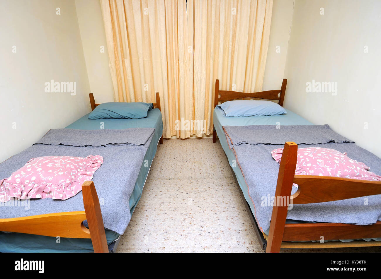 Twin beds in simple motel room. Suitable for concepts such as budget ...