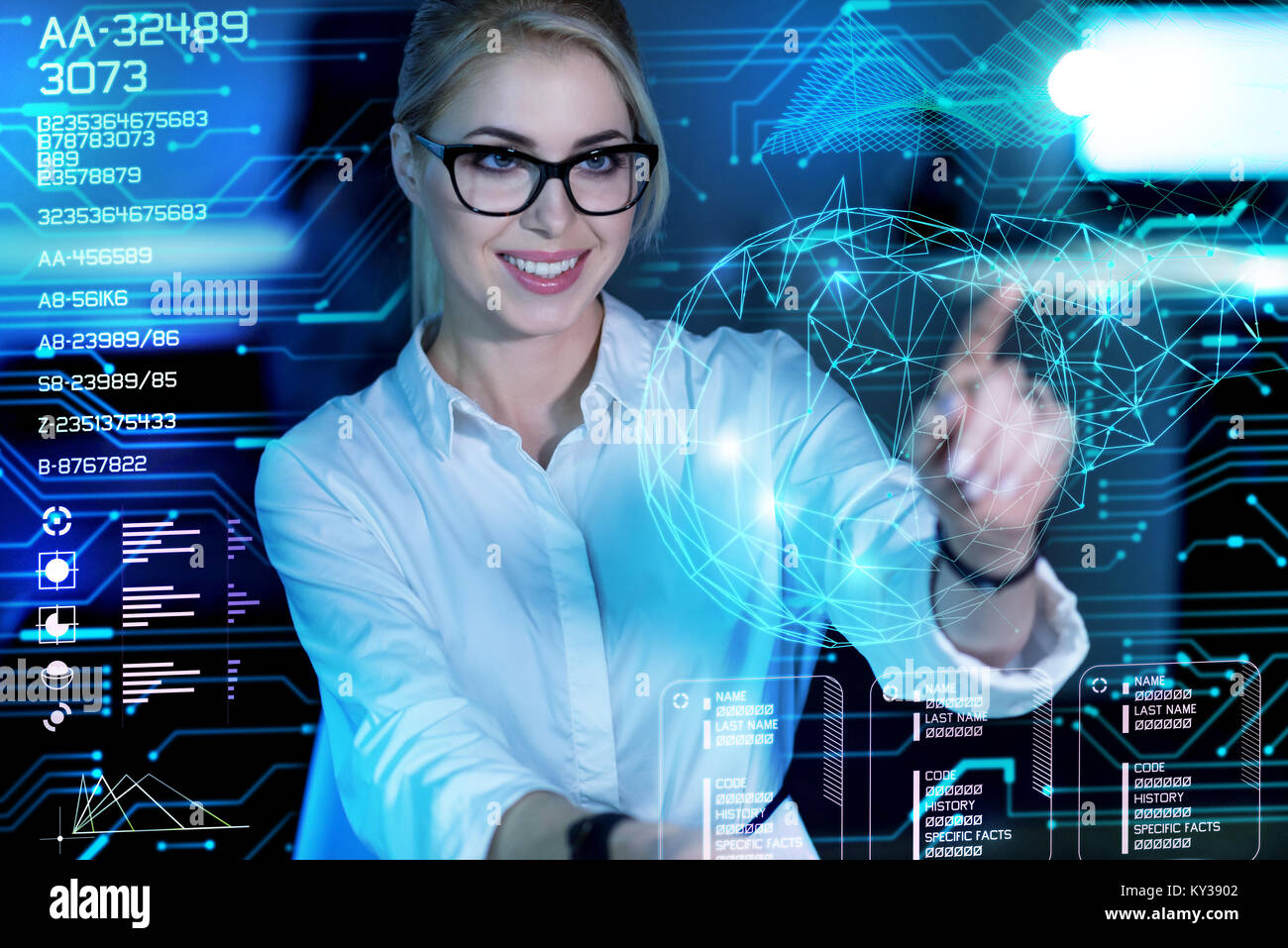 Beautiful programmer touching a transparent screen and looking happy ...