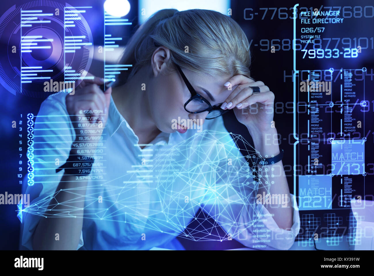 Busy young programmer touching her forehead while thinking Stock Photo ... Busy young programmer touching her forehead while thinking Stock Photo ...