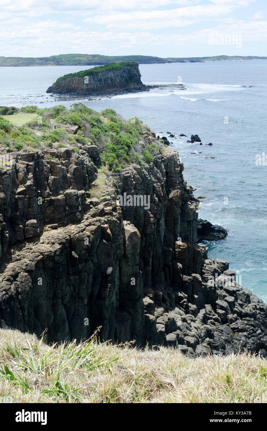 Rocky cliffs near Minnamurra river estuary, near Kiama, New South Wales ...