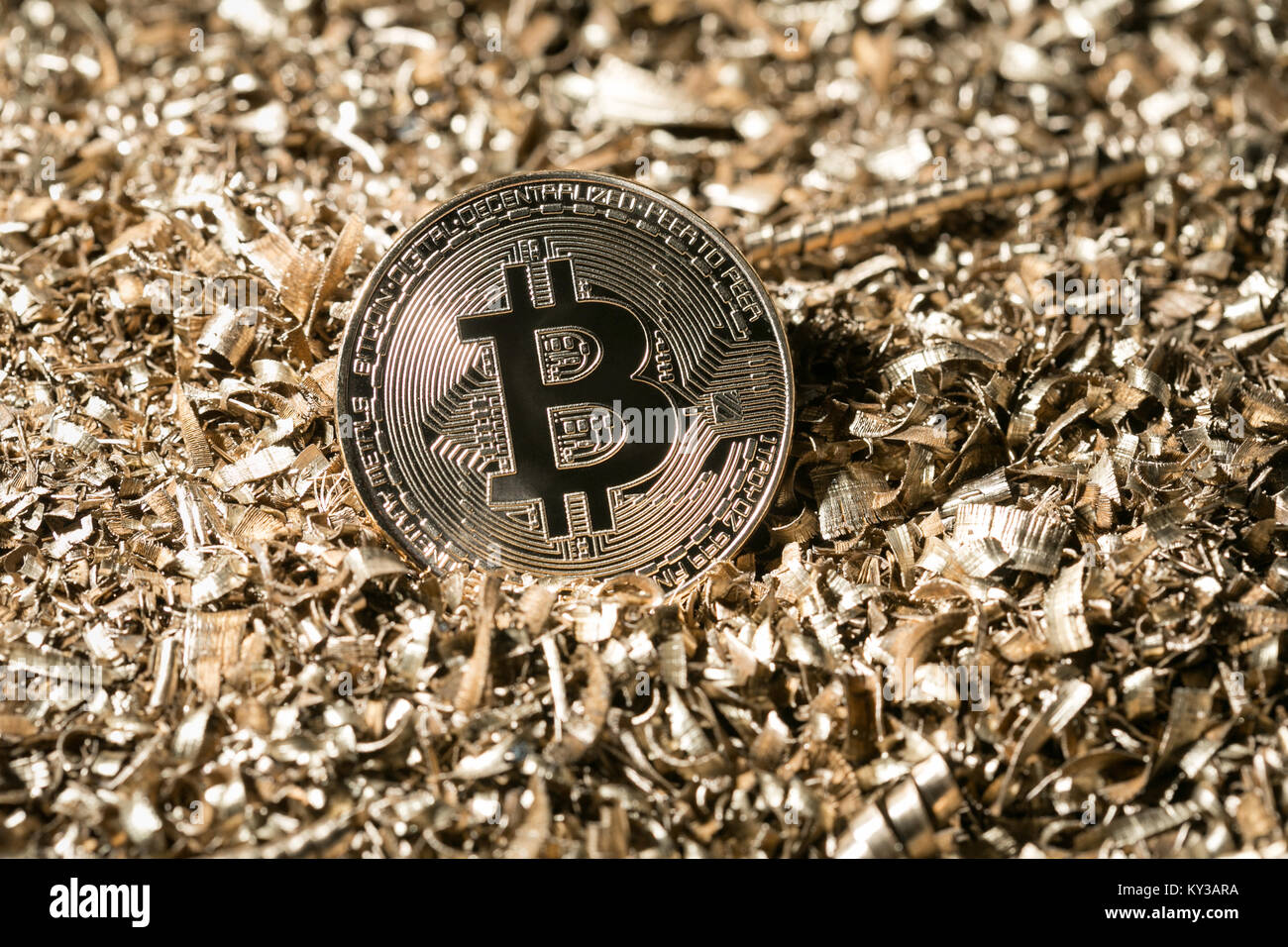 Golden metal coin as symbolic version of Bitcoin on a background of ...