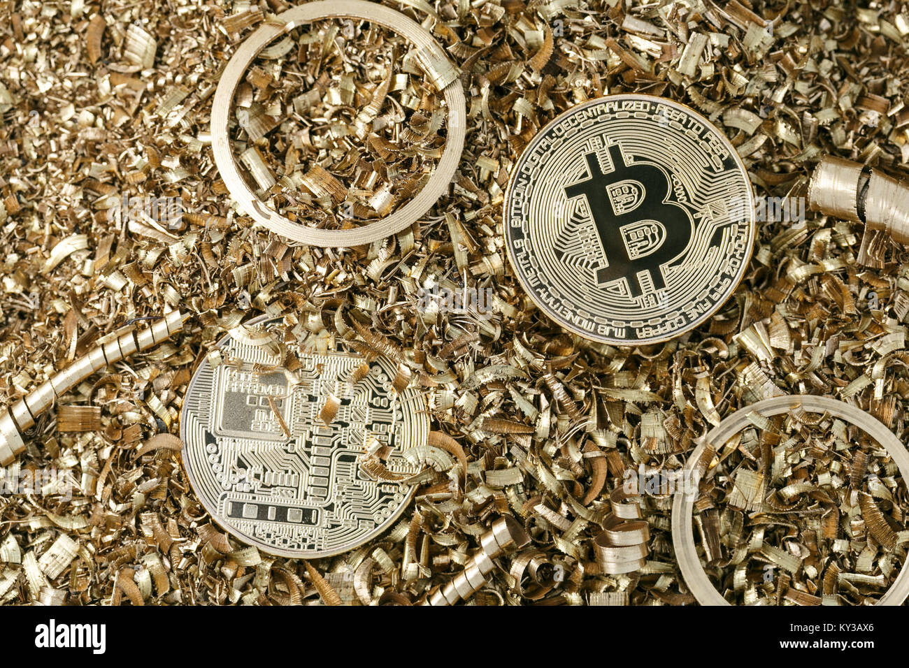 Golden metal coin as symbolic version of Bitcoin on a background of ...