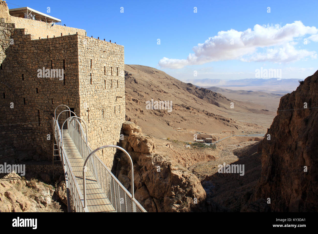 Iron bridge, stone buildings of monastery Mar Musa, Syria Stock Photo ...
