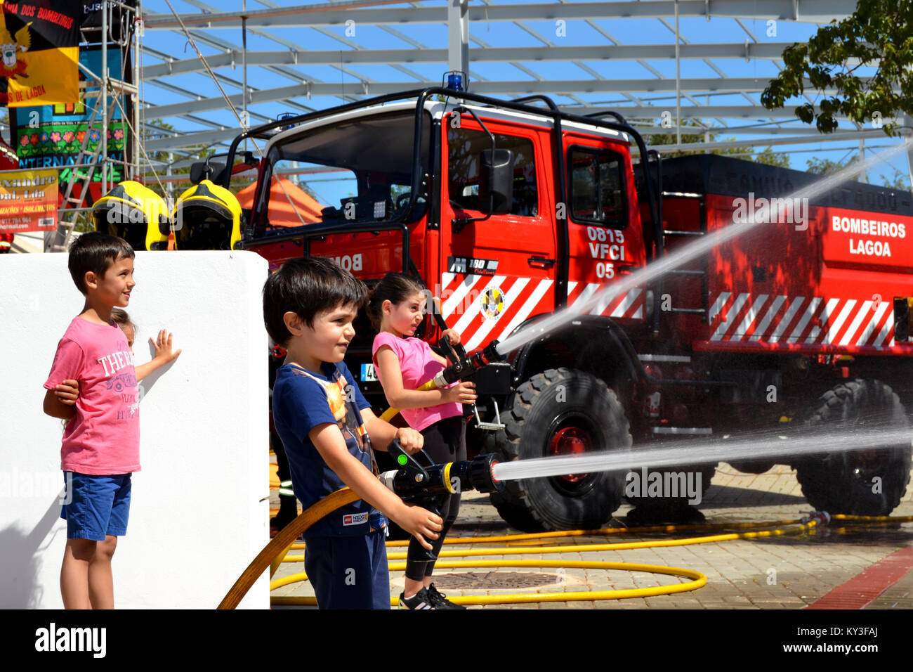 Children with fire and rescue hose hi-res stock photography and images ...