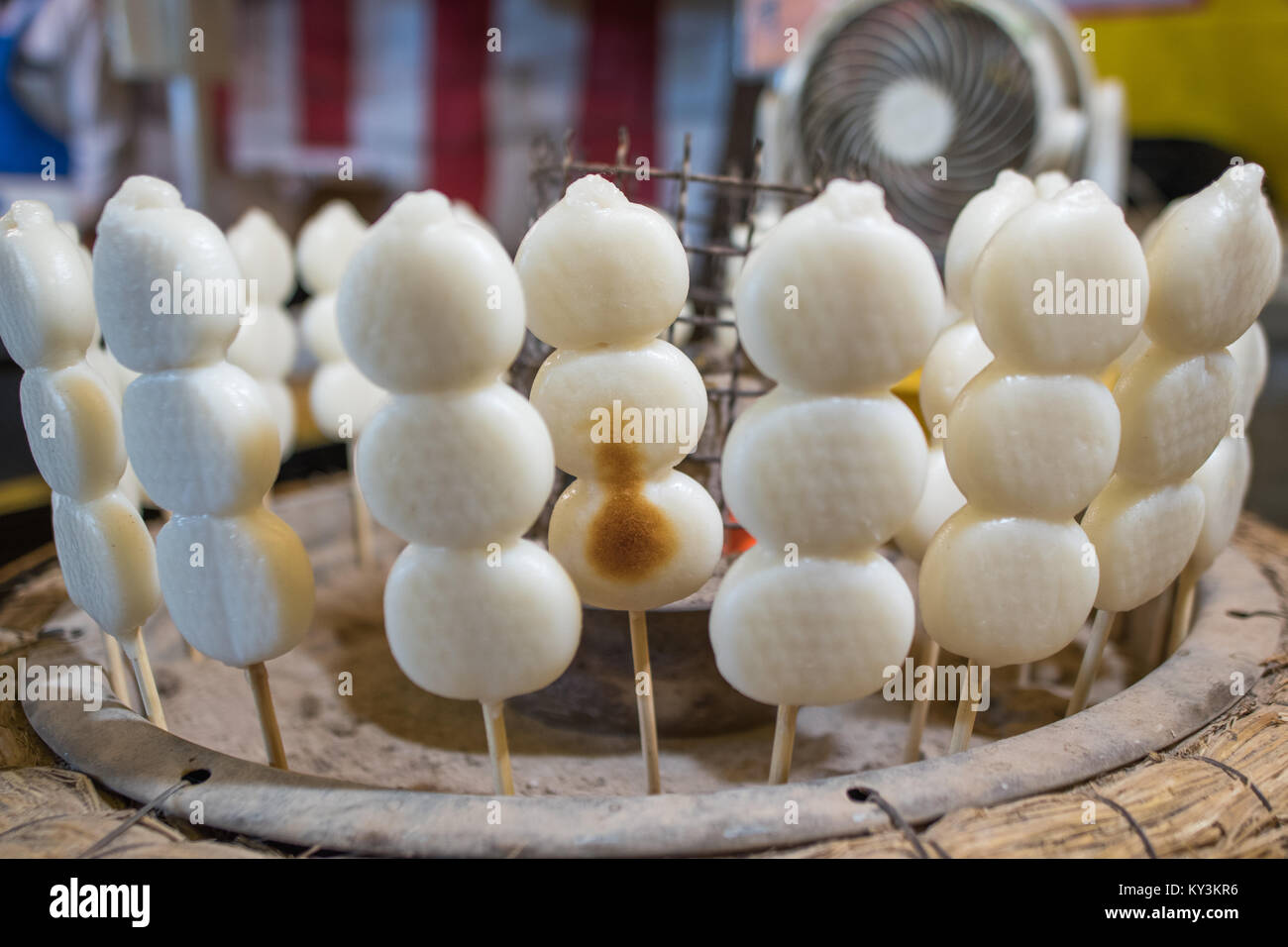rice ball dango stick charcoal grill put in hay Stock Photo - Alamy