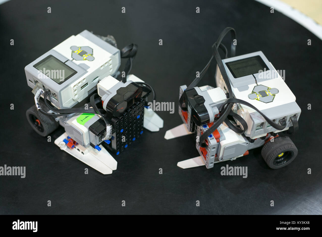 technology, invention, machining concept. close up of two robots that ...