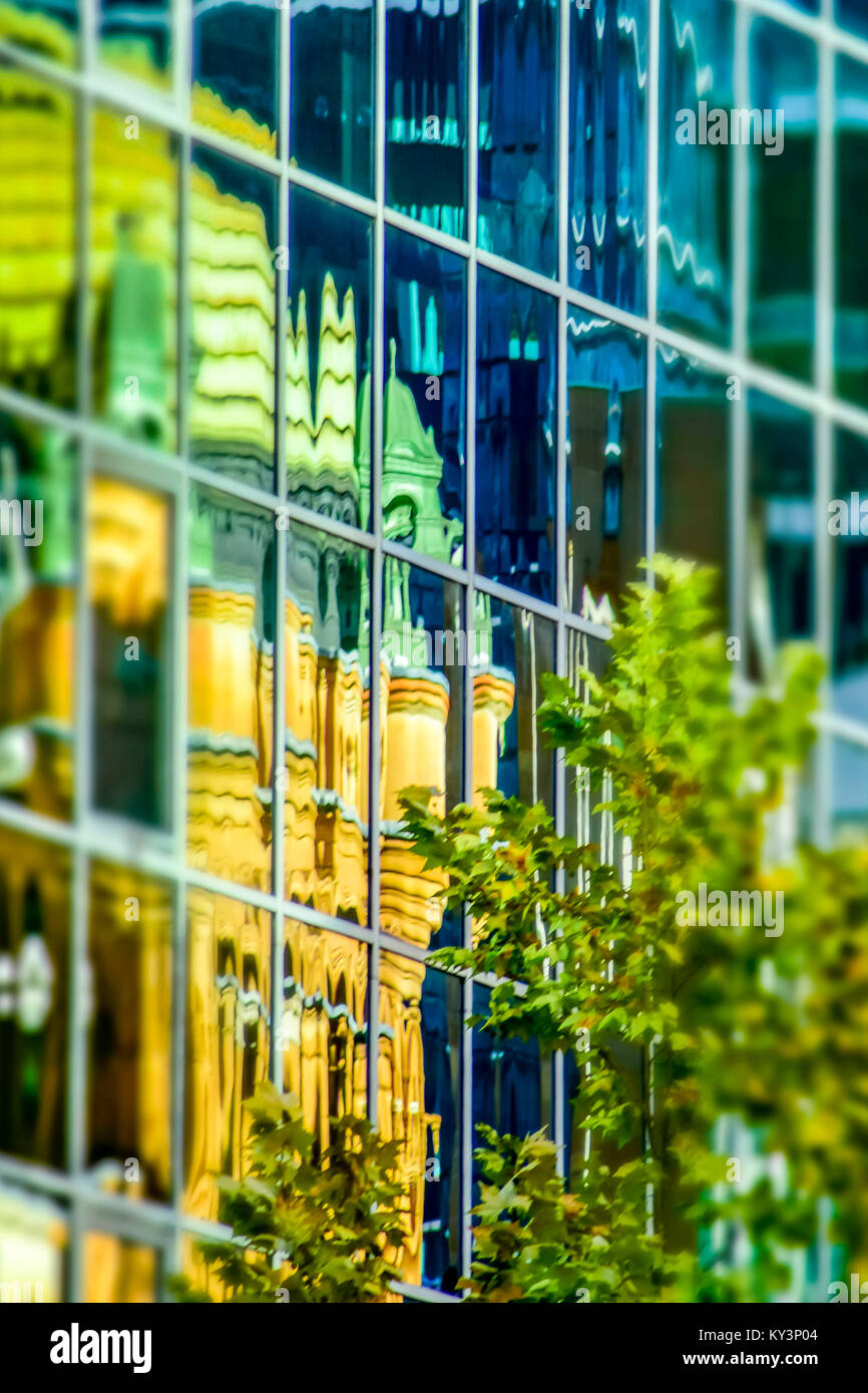 Queen Victoria Building reflected in modern glass high rise building ...