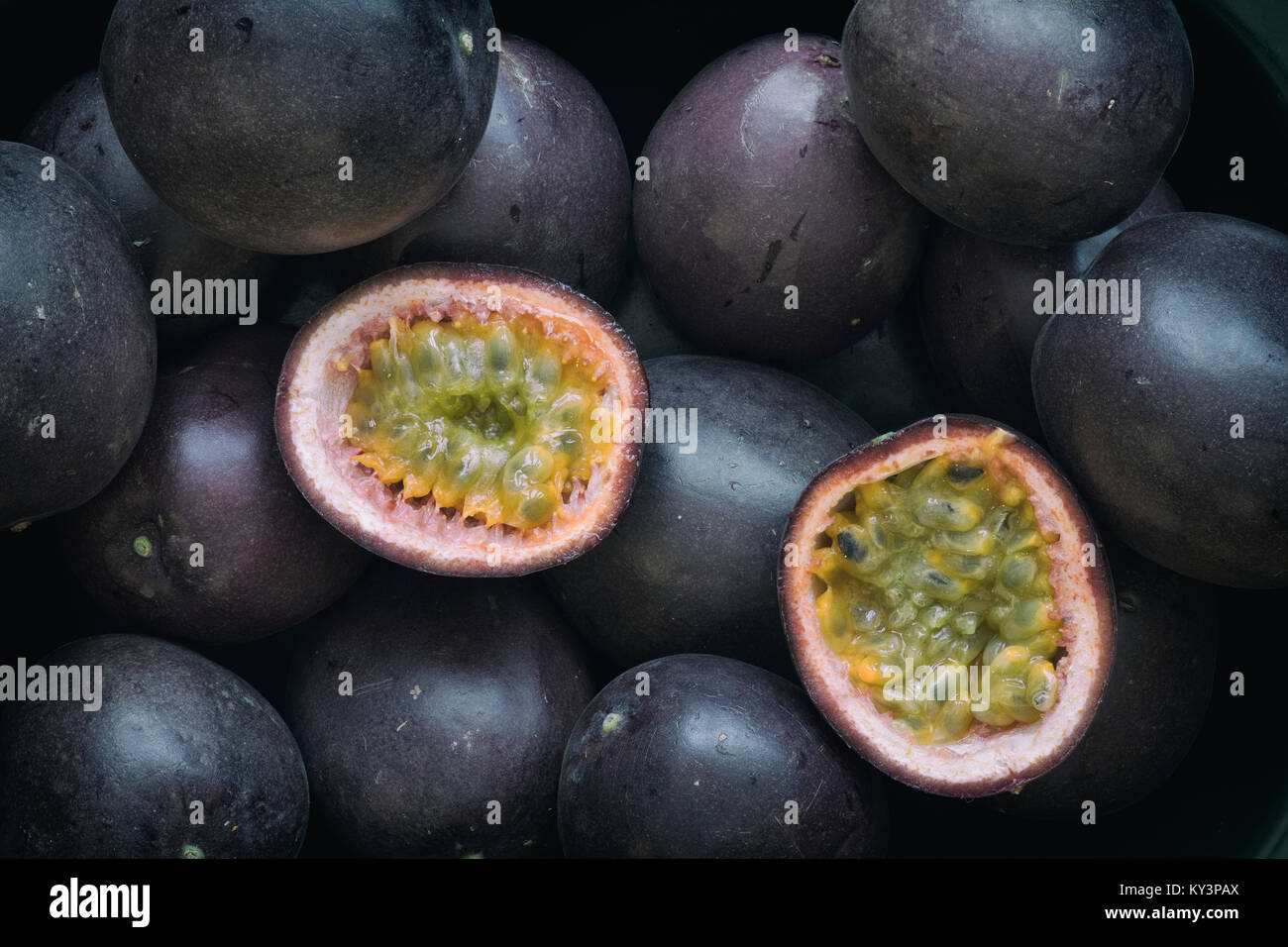 Passiflora edulis . Passion fruits with one cut in half Stock Photo - Alamy